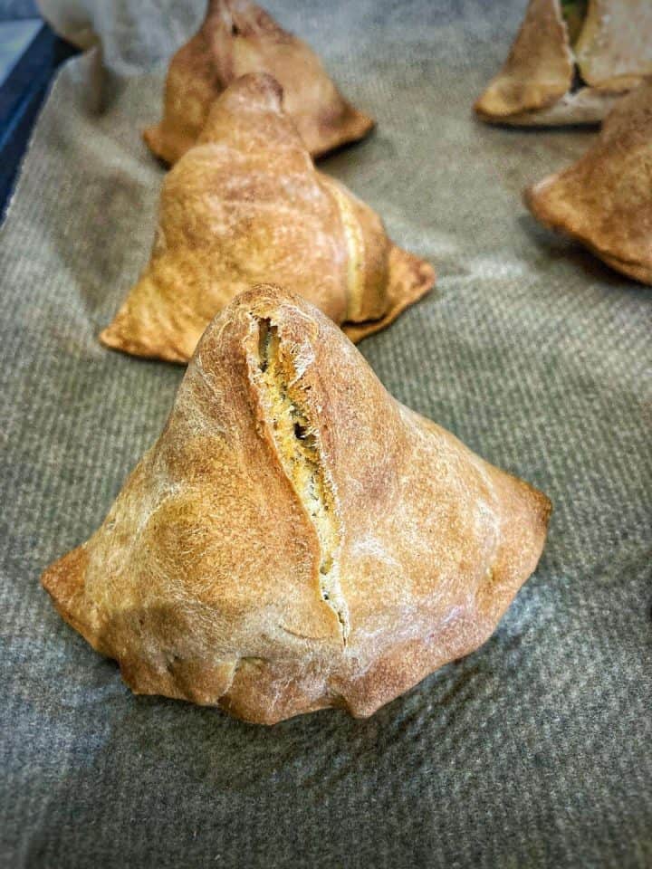 baked samosa on baking tray | Spice and Life